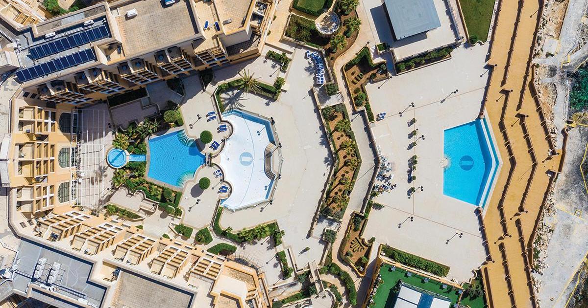 Eerily beautiful aerial photos show empty hotel pools during lockdown