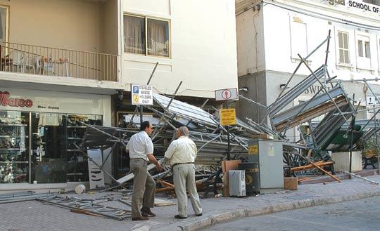 Two workers hurt as scaffolding collapses into busy street