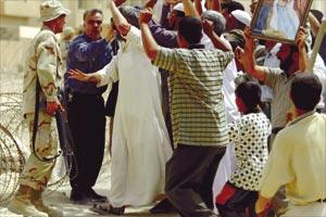 US troops ambushed in Iraq as new raids launched