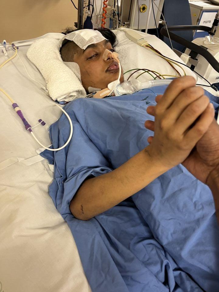 Husband’s vigil for wife in coma after crash that claimed unborn baby