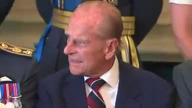UK's Prince Philip caught on camera swearing at photographer