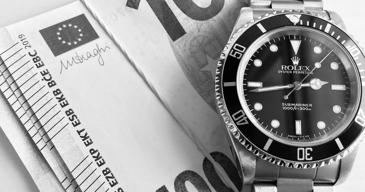 Woman denies trying to buy Rolex watch with fake money
