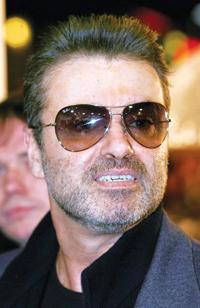 George Michael held after car crashes into shop