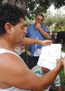 Bus drivers display pay slip and expenses