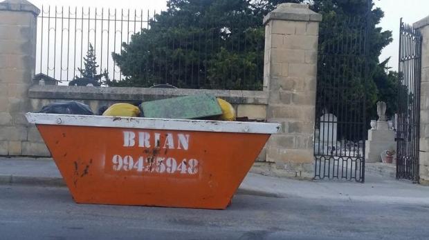 Skip full of coffin remains infuriates residents