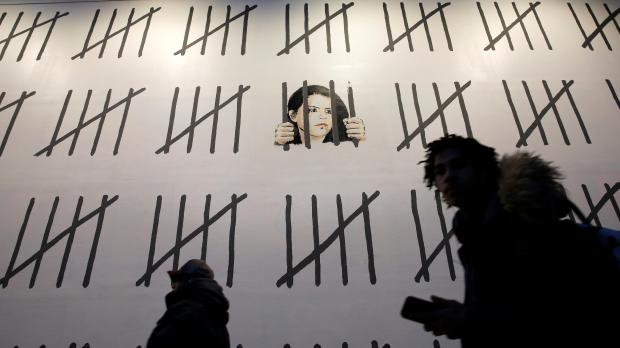 Banksy unveils mural protesting jailed artist