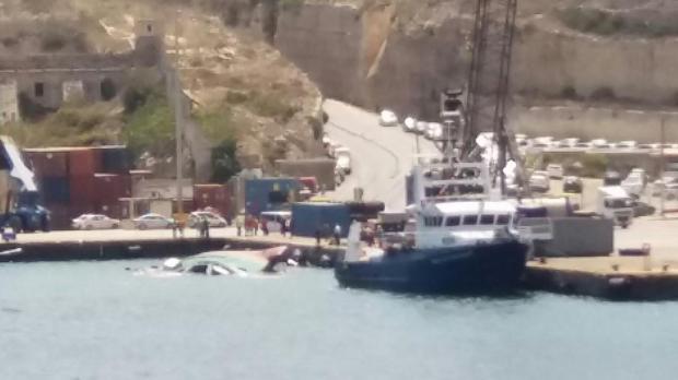 Watch: Small ship capsizes in harbour after collision with cargo vessel ...
